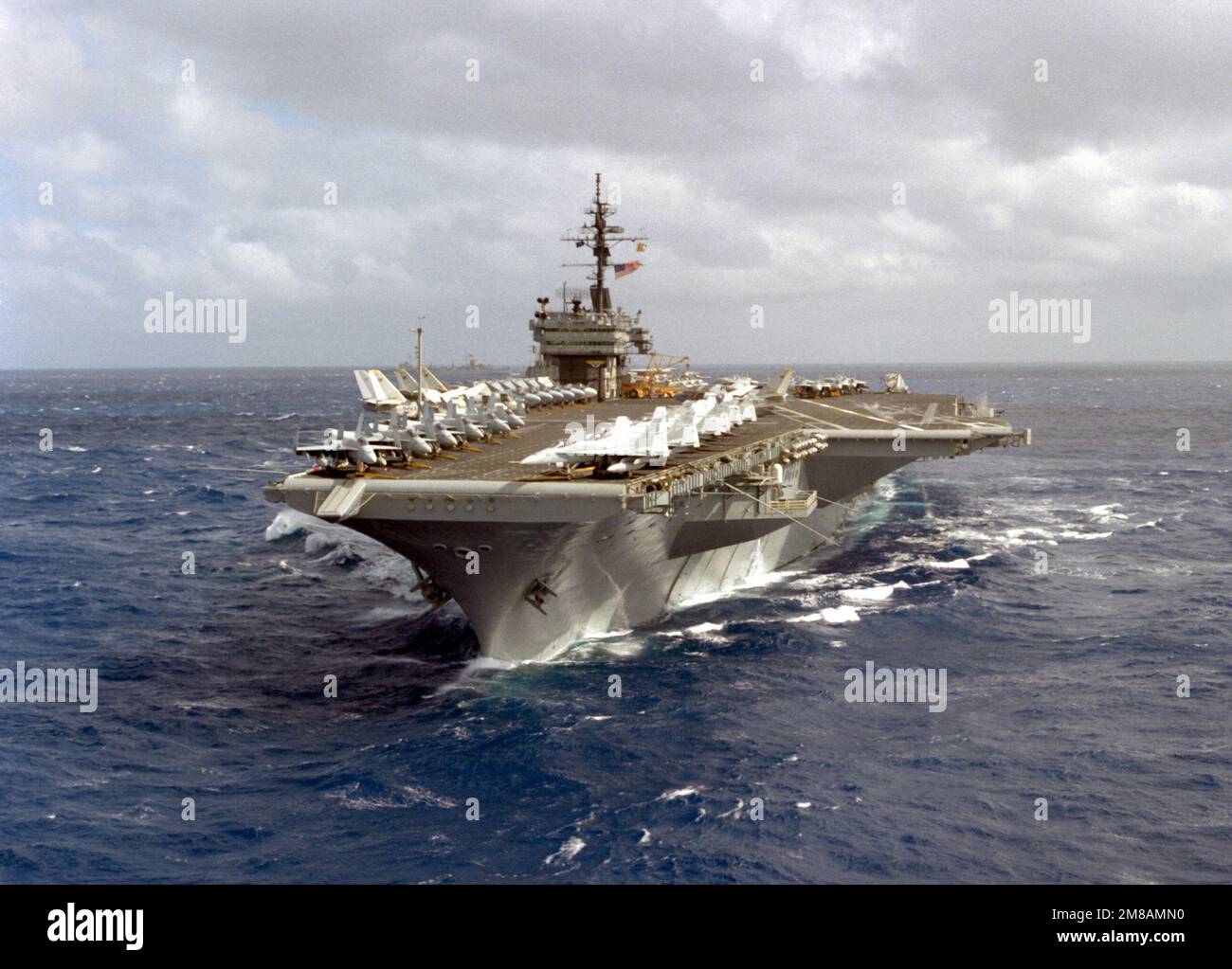 A port bow view of the aircraft carrier USS CONSTELLATION (CV-64) underway with various aircraft ...