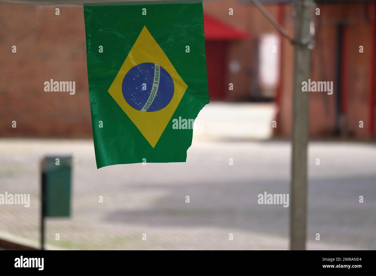 Brazilian paper flag hanging on a wire as a decoration element in a ...