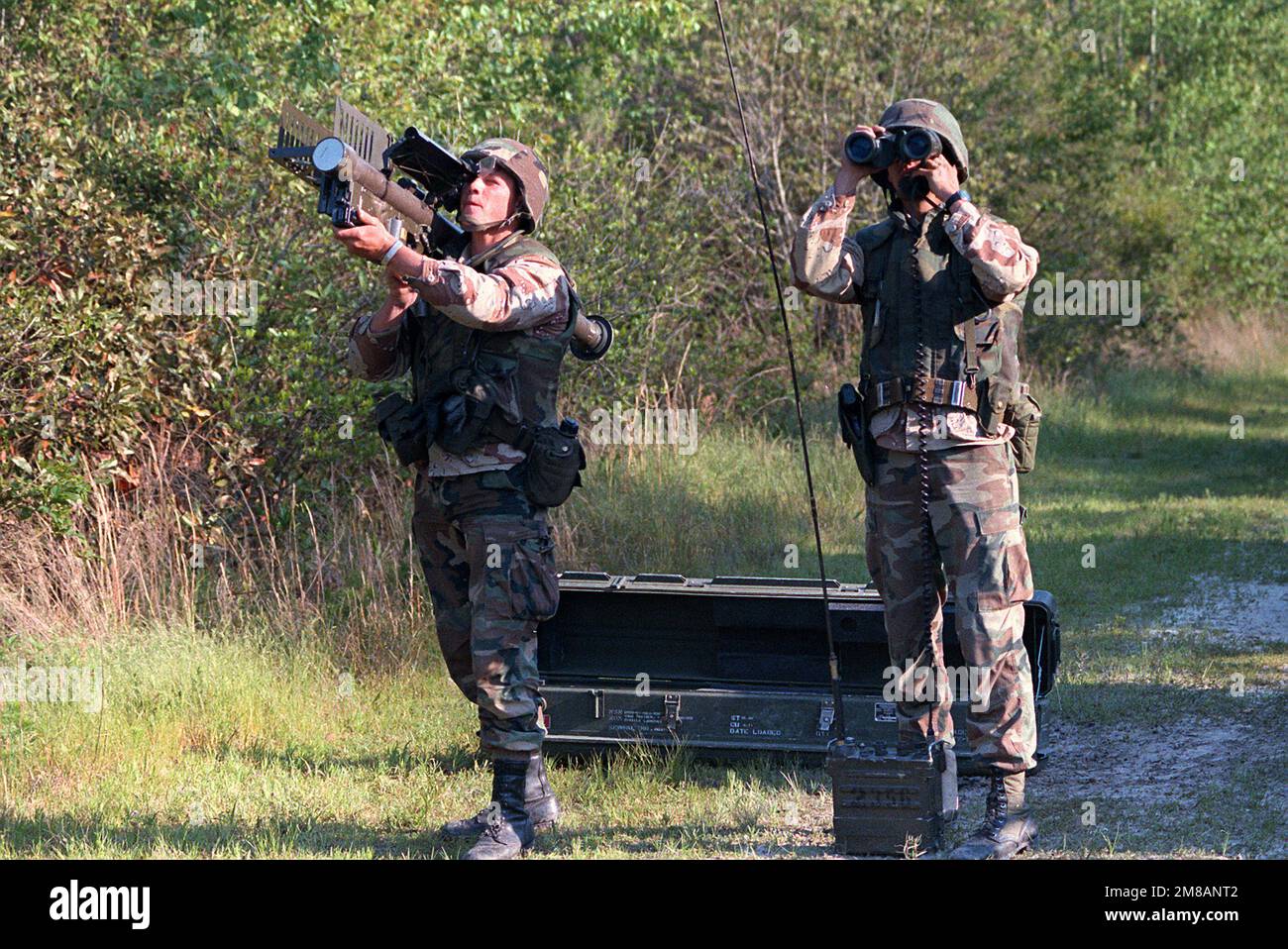 A Marine prepares to fire a stinger anti-aircraft guided missile from a ...
