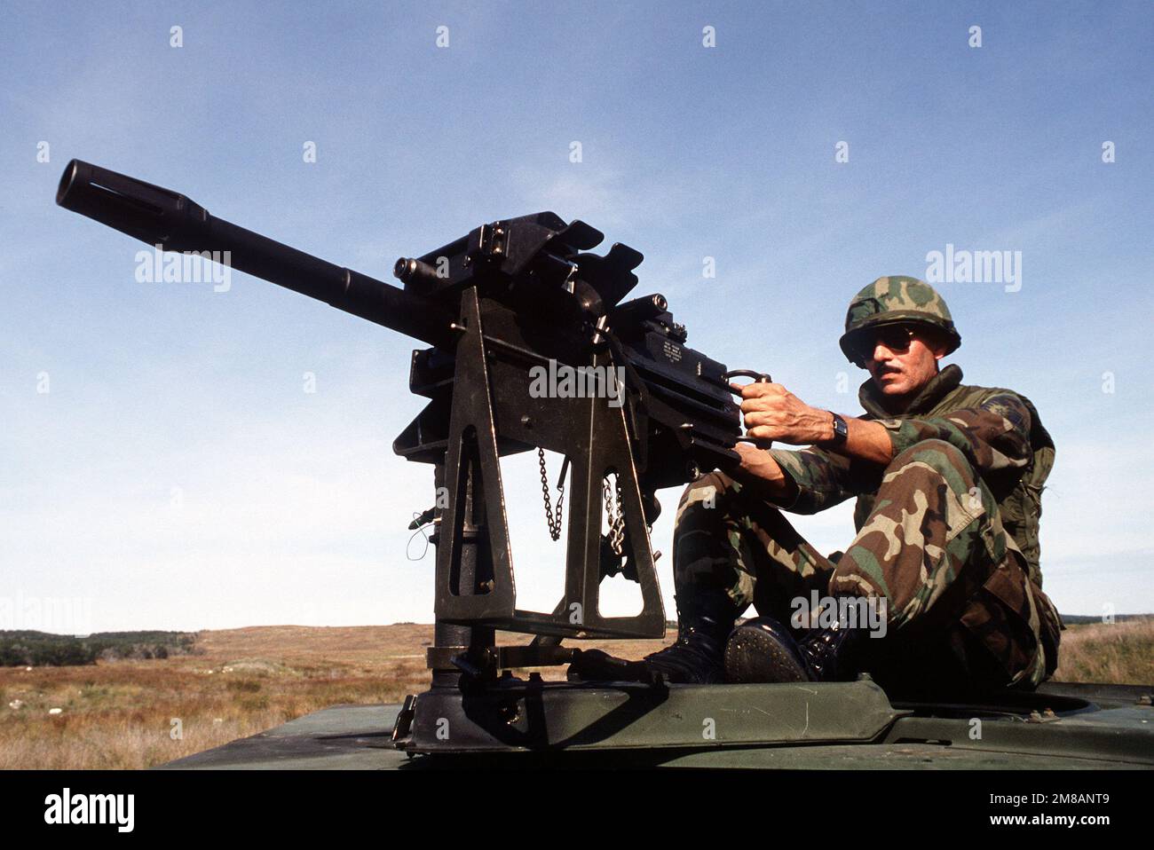 Security policeman mans a Browning M-2, 50 Cal machine gun mounted on a ...