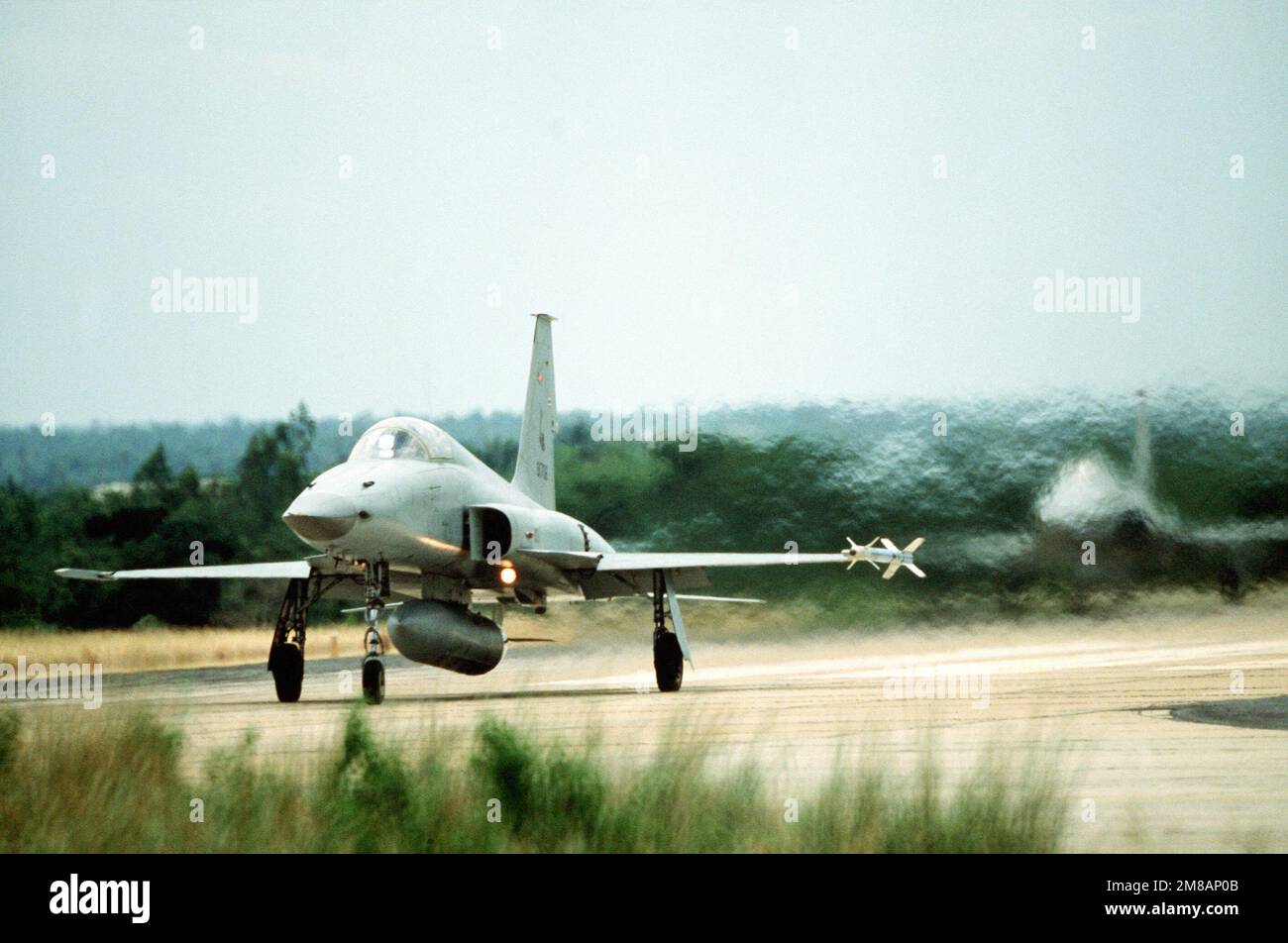 A Royal Thai Air Force F-5E Tiger II aircraft begin its takeoff roll at ...