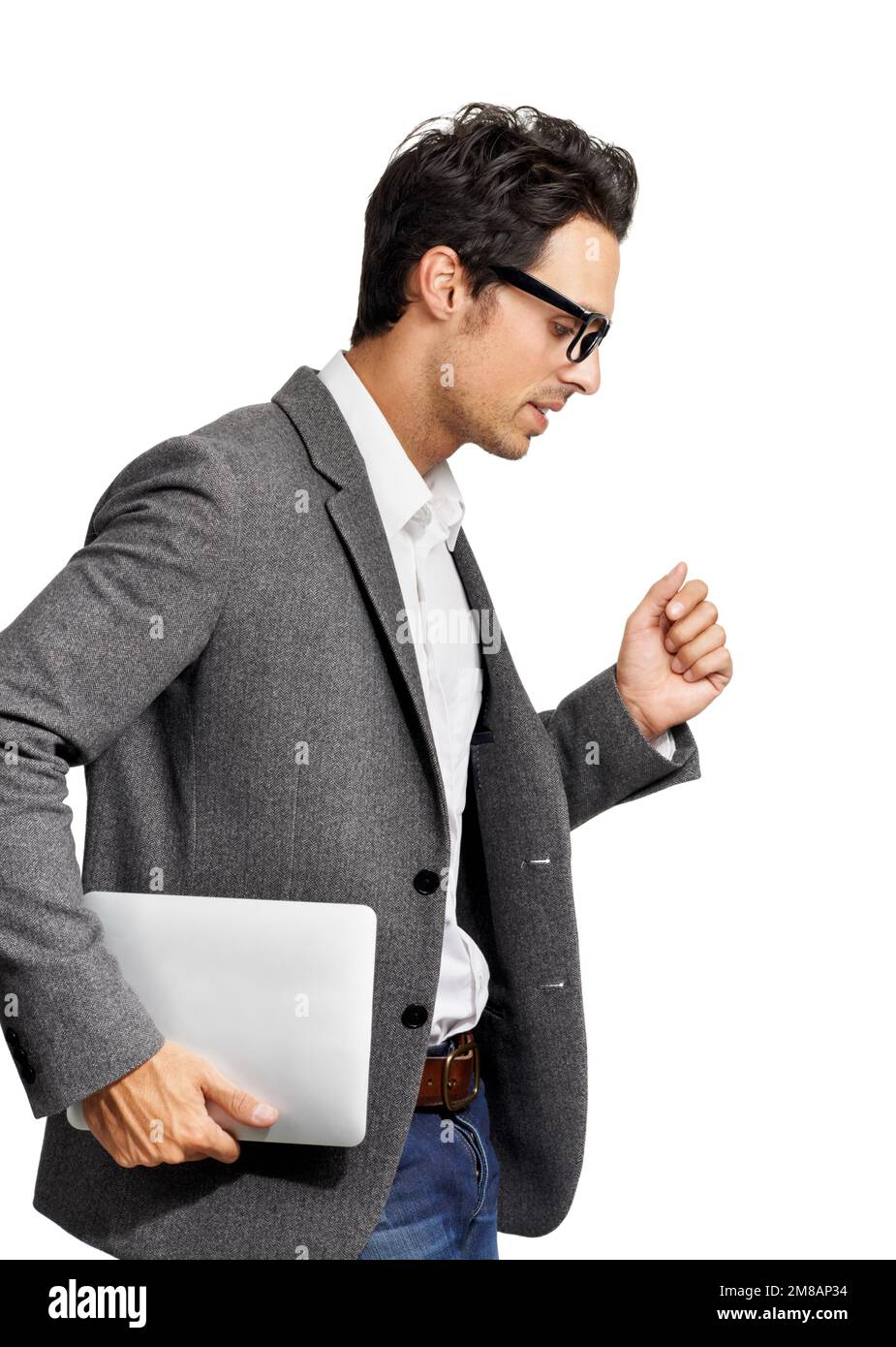 Rushing with a tablet in hand. Profile of a handsome young man running ...