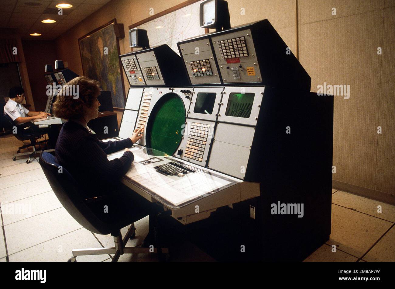 A student at the U.S. Air Force Weapons Controller School operates an ...