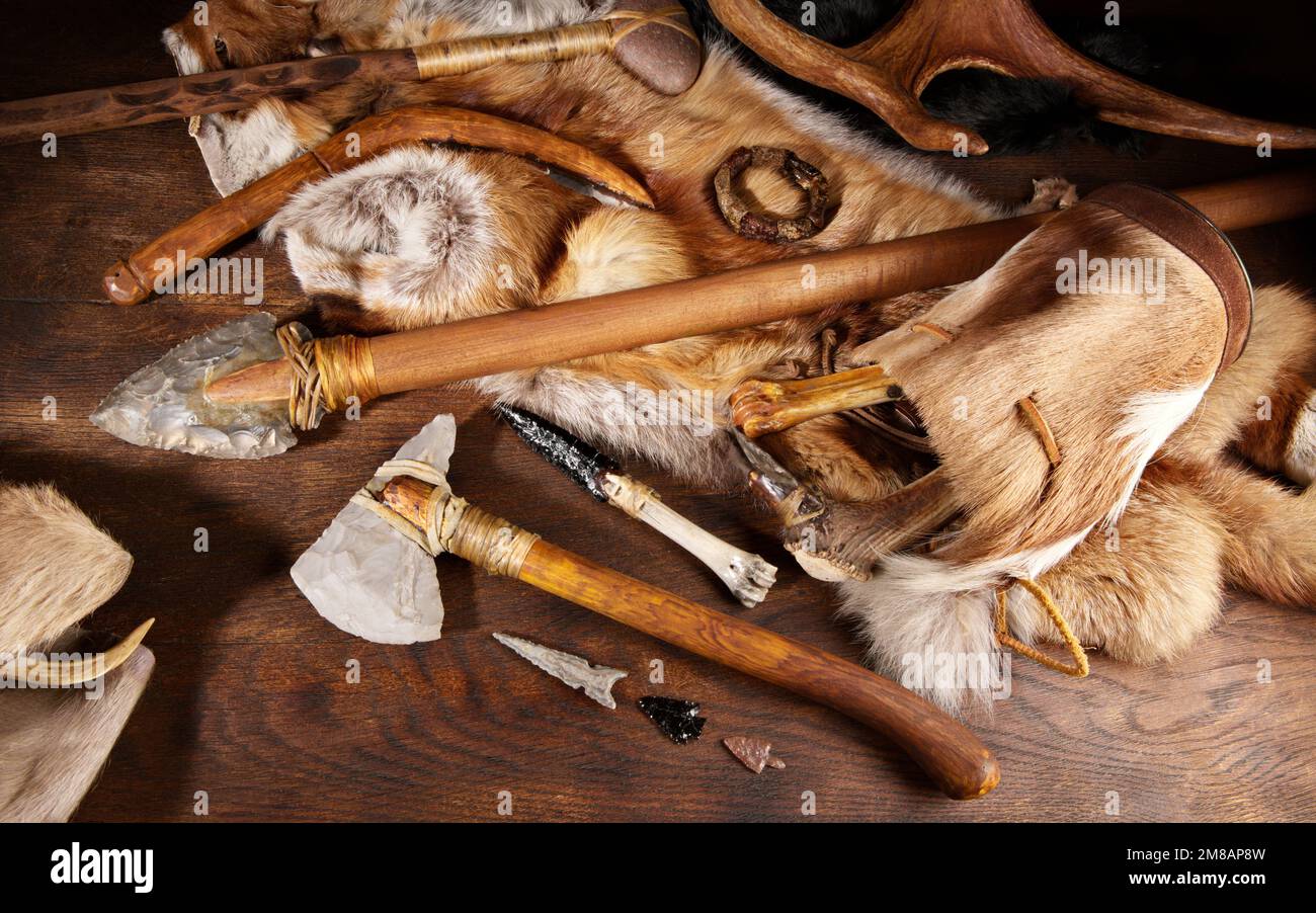 Stone Age Tools on wooden Background - Panoramic View Stock Photo - Alamy