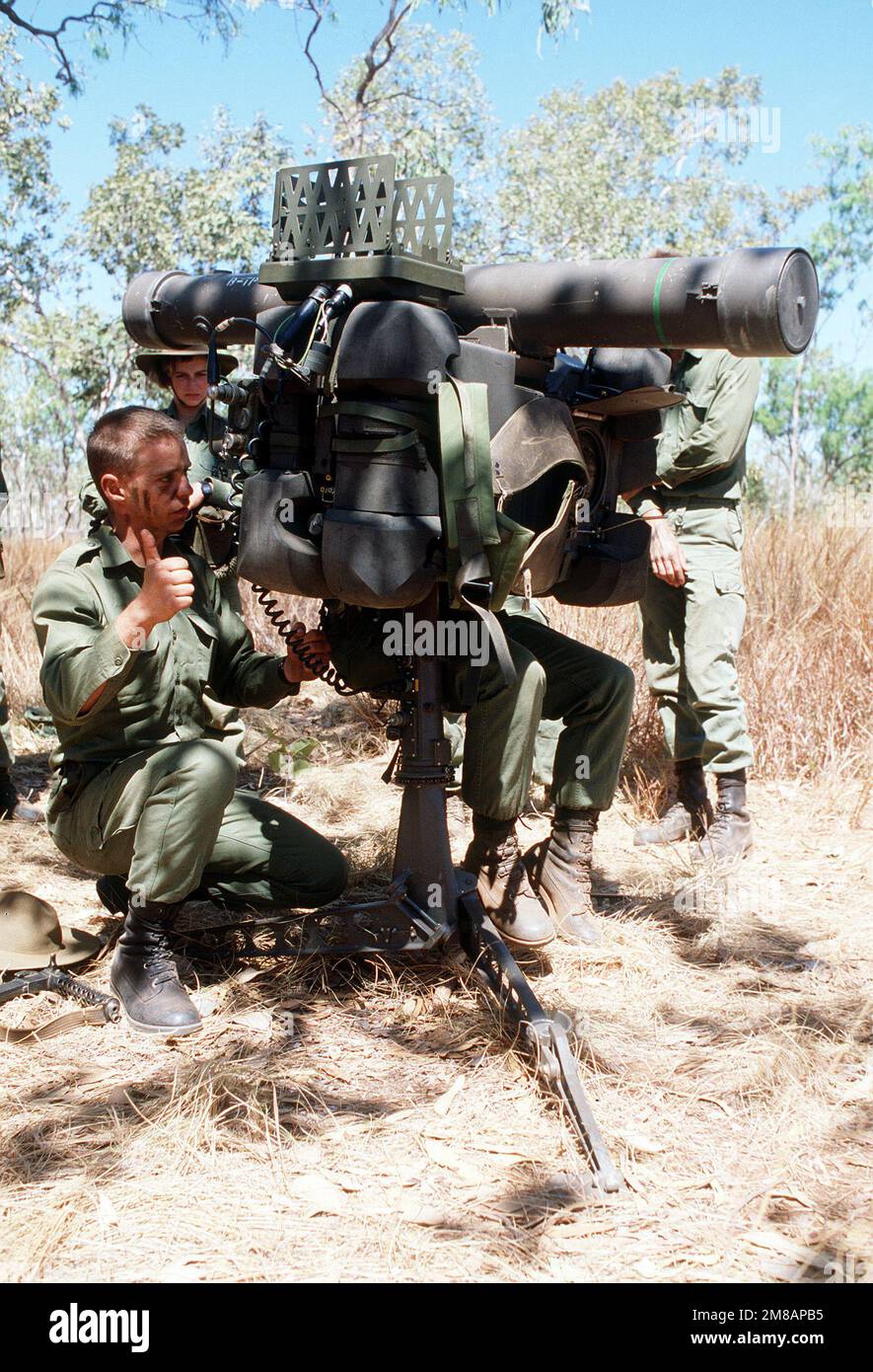 Australian soldiers set up an RBS-70 anti-aircraft missile system ...