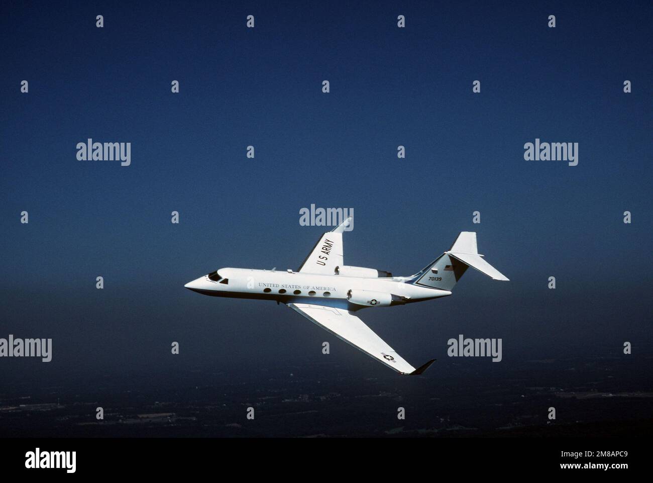 An air-to air-left side view of a C-20E Gulfstream III aircraft. The ...