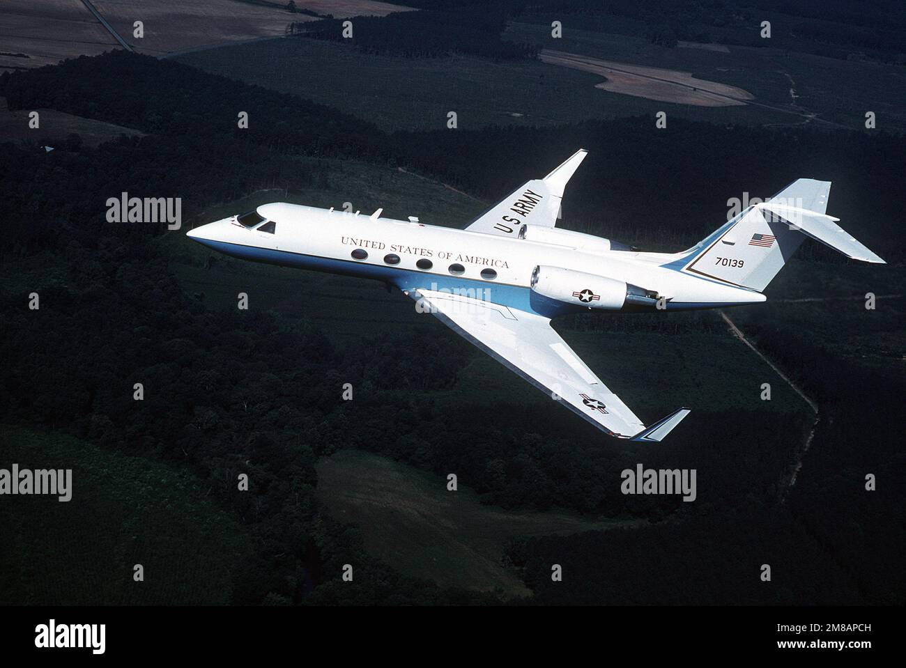 An air-to-air left side view of a C-20E Gulfstream III aircraft. The ...