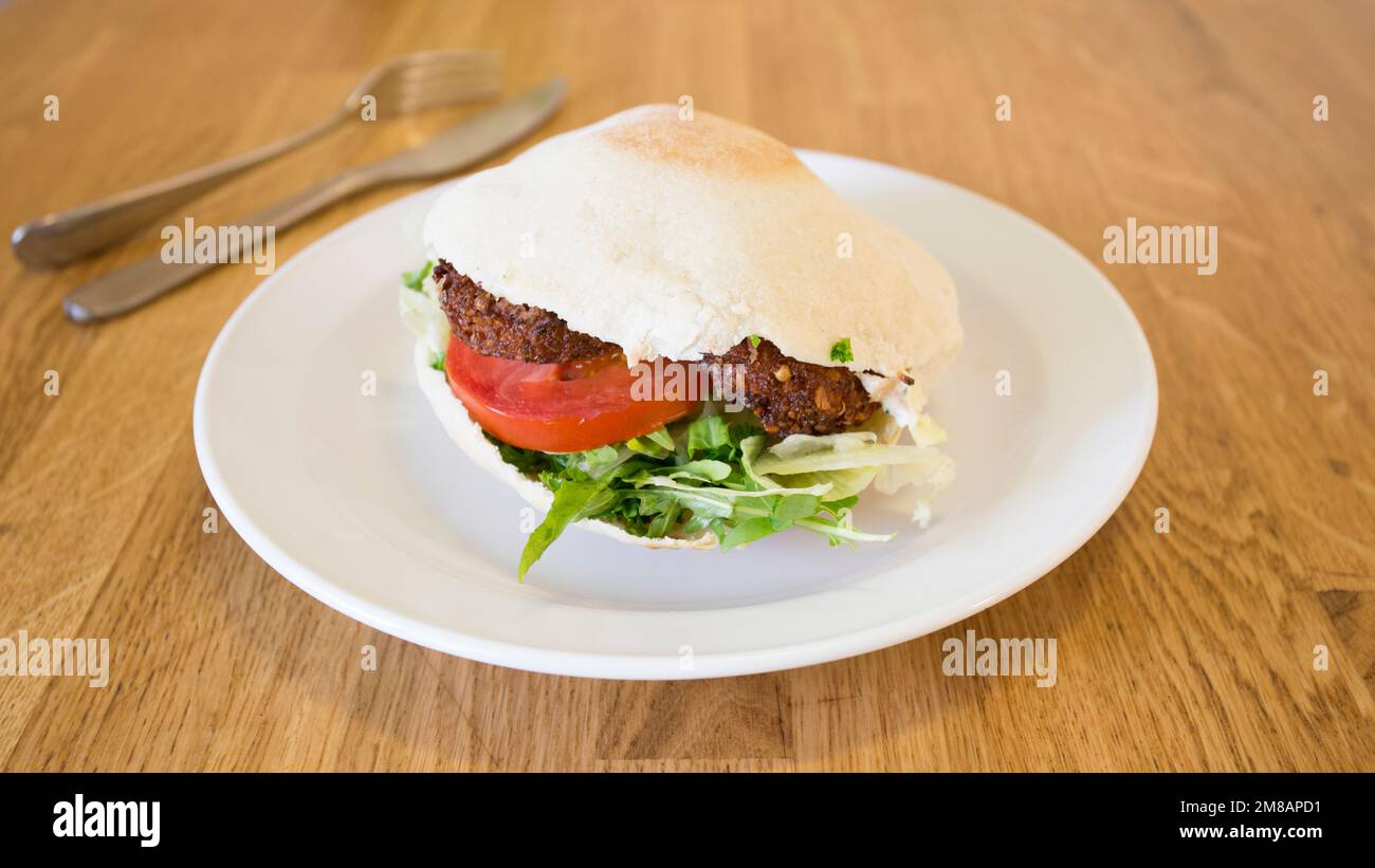 Falafel combo dish with vegetables. Faláfel or falafel is a chickpea or ...