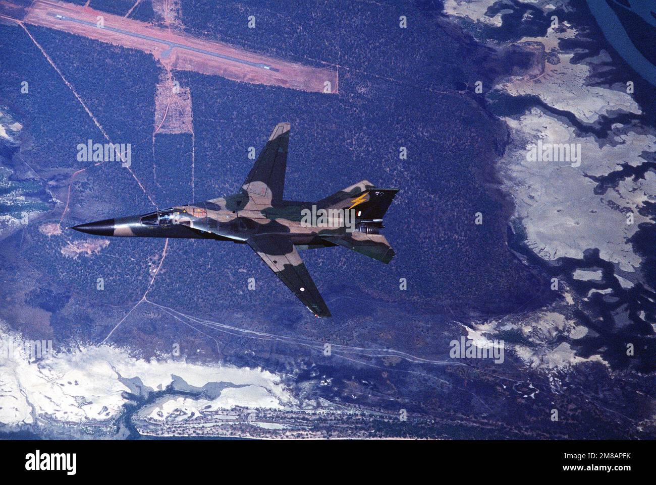 A Royal Australian Air Force (RAAF) F-111C aircraft flies high over an ...