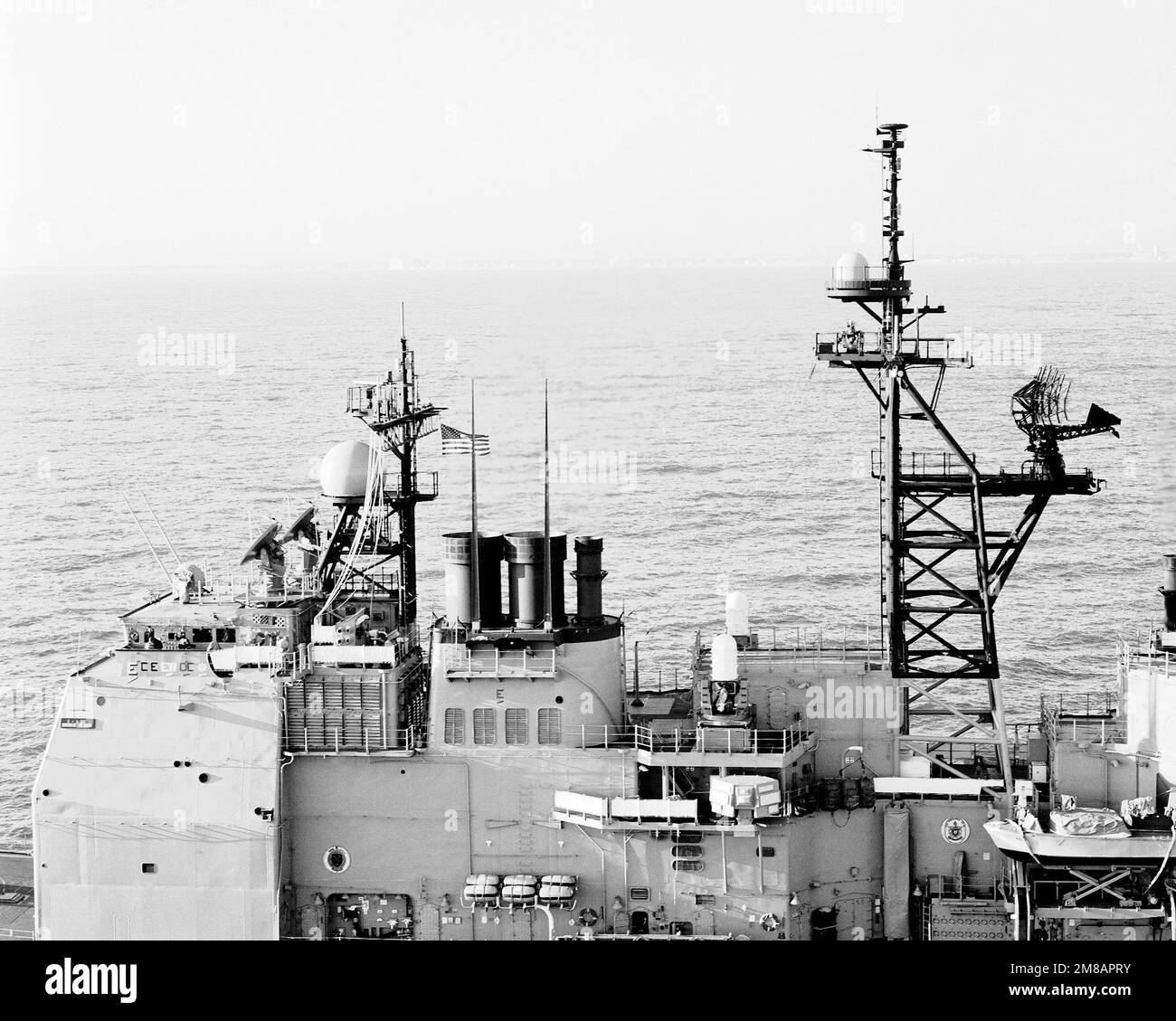 A close-up view of the antenna masts and bridge structure aboard the ...