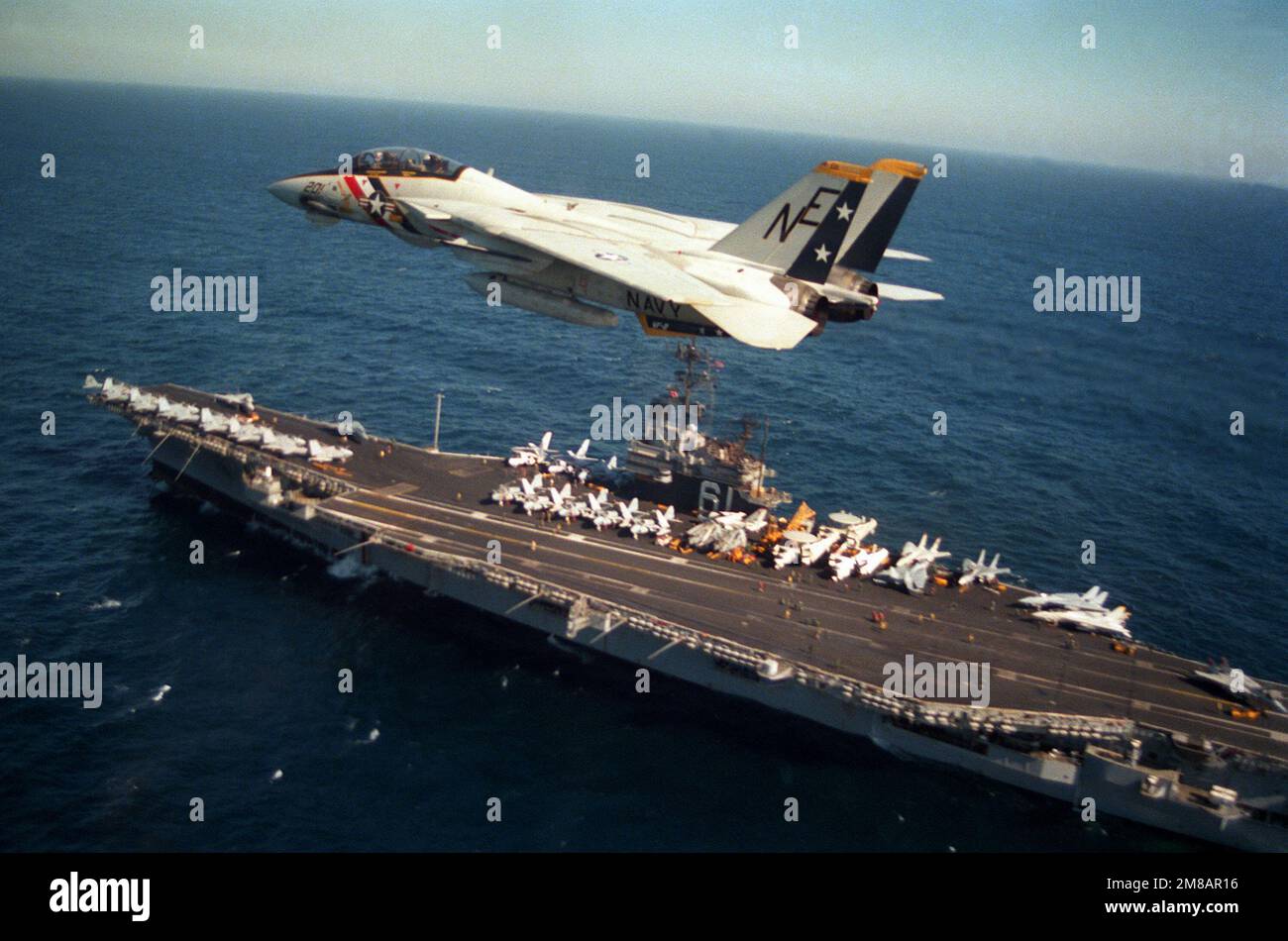 A Fighter Squadron 2 (VF-2) F-14A Tomcat aircraft flies past the ...