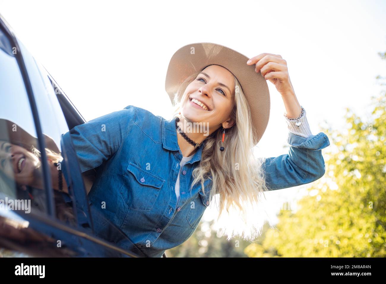 Lean out of window hi-res stock photography and images - Alamy