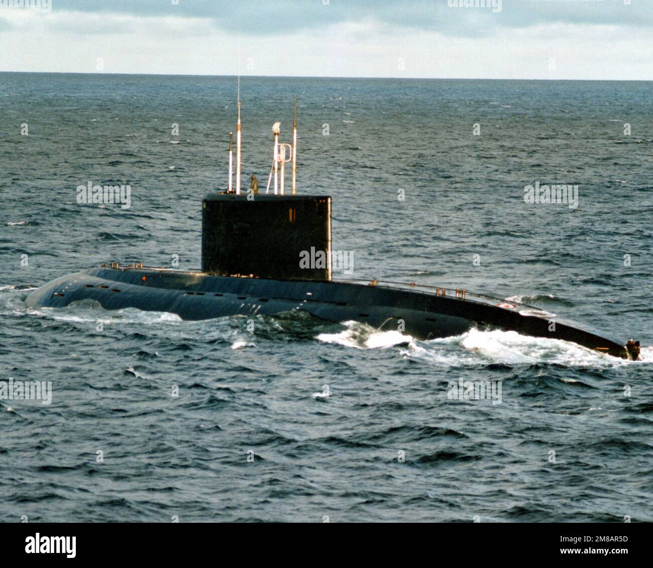 A port view of a Soviet Kilo-class patrol submarine underway on the ...