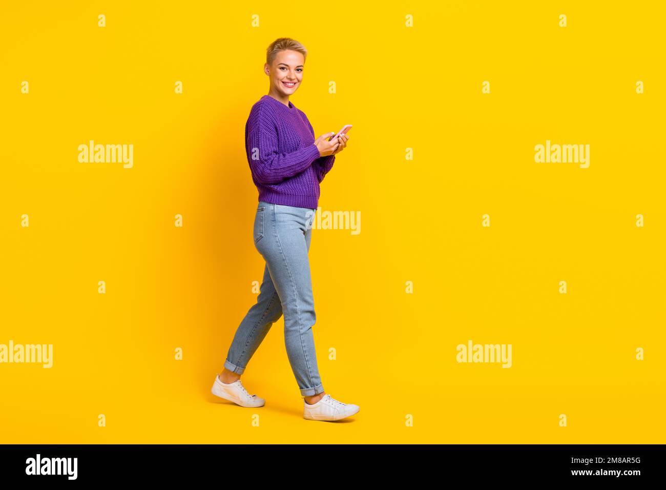 Full size profile photo of positive charming girl use telephone walk ...