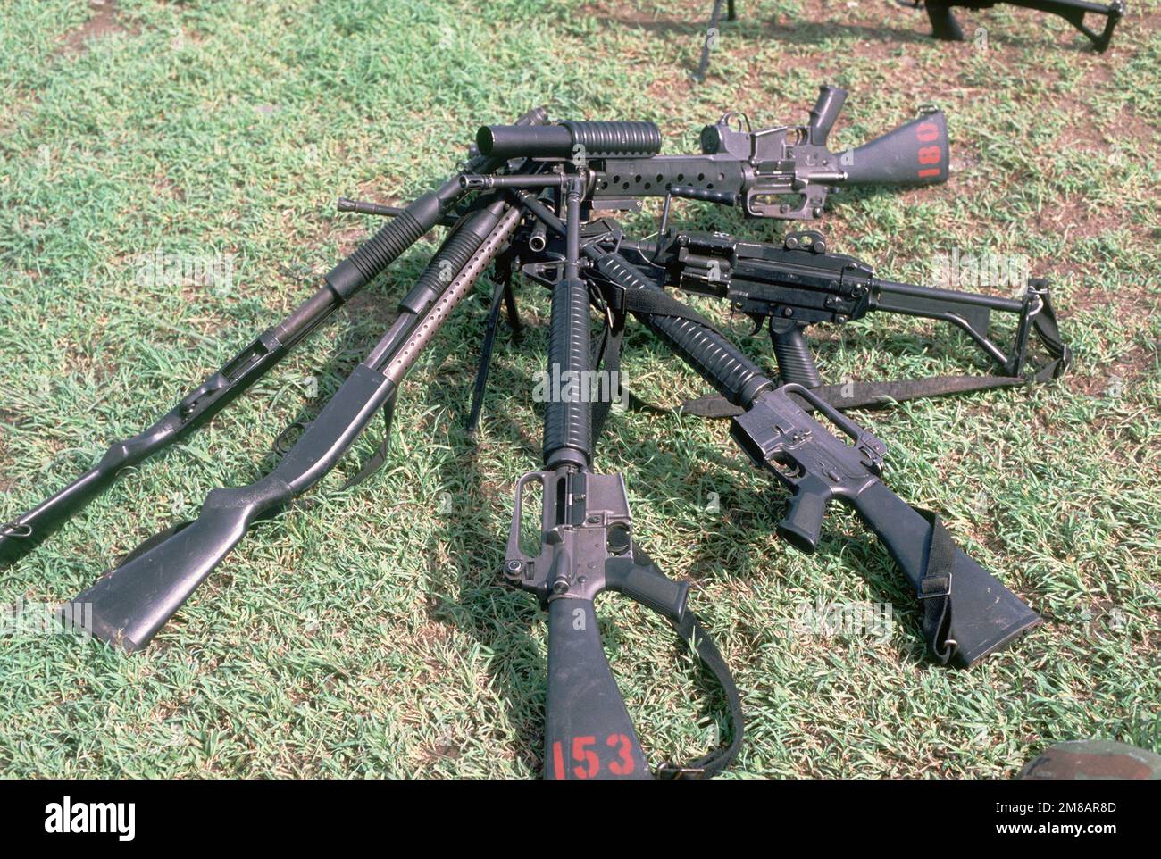 Some of the types of small arms used by Marines in Panama are stacked ...