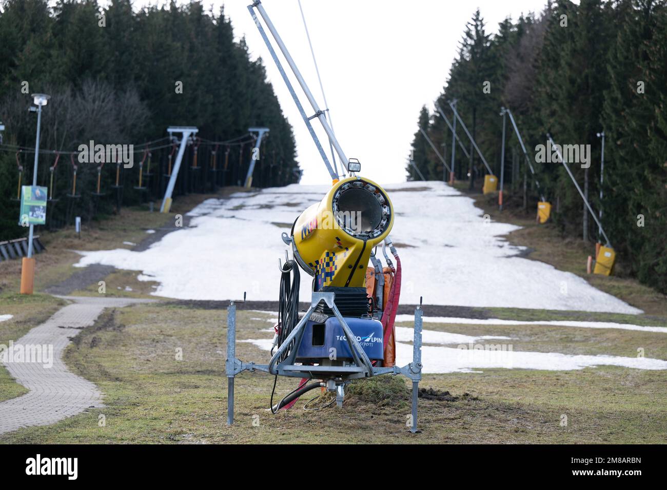 Altenberg, Germany. 13th Jan, 2023. A snow cannon stands in front of an ...