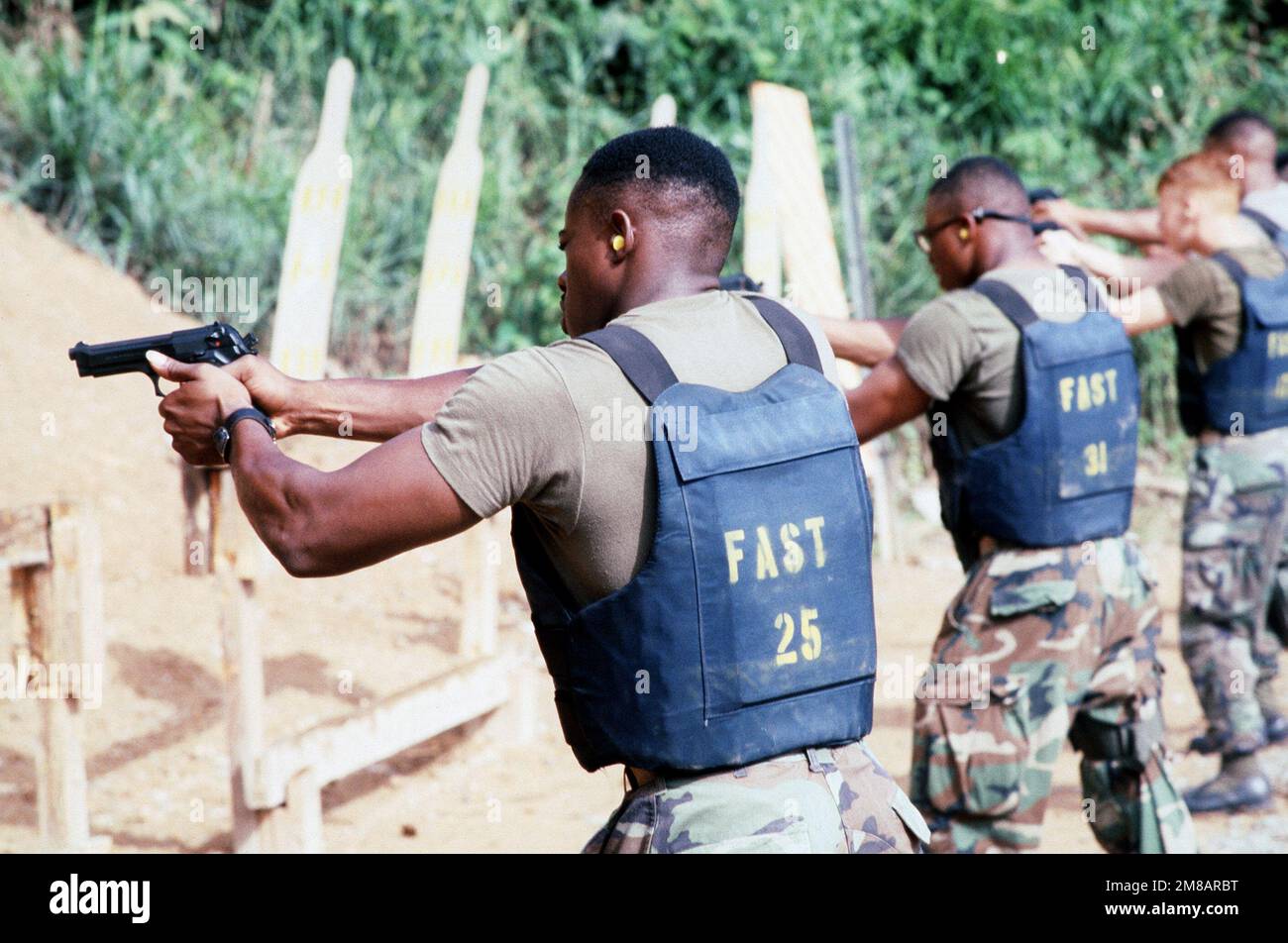 Marines with M9 9 mm pistols engage their targets at a combat pistol ...