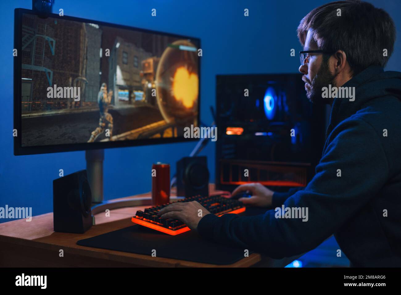 Young Caucasian Pro Gamer playing in Online Cyber Sport Game at home in ...