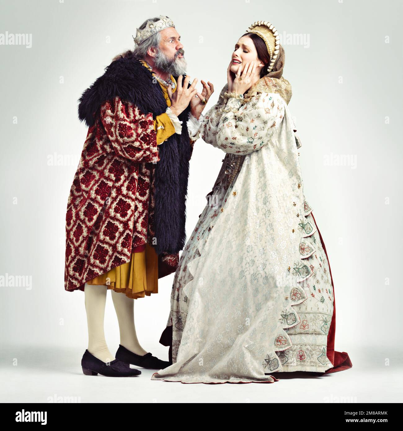 Royalty, renaissance and a king arguing with his queen in studio on a ...