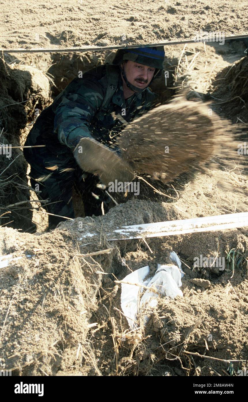 A sergeant digs a bunker for exercise Team Spirit '89. Subject ...