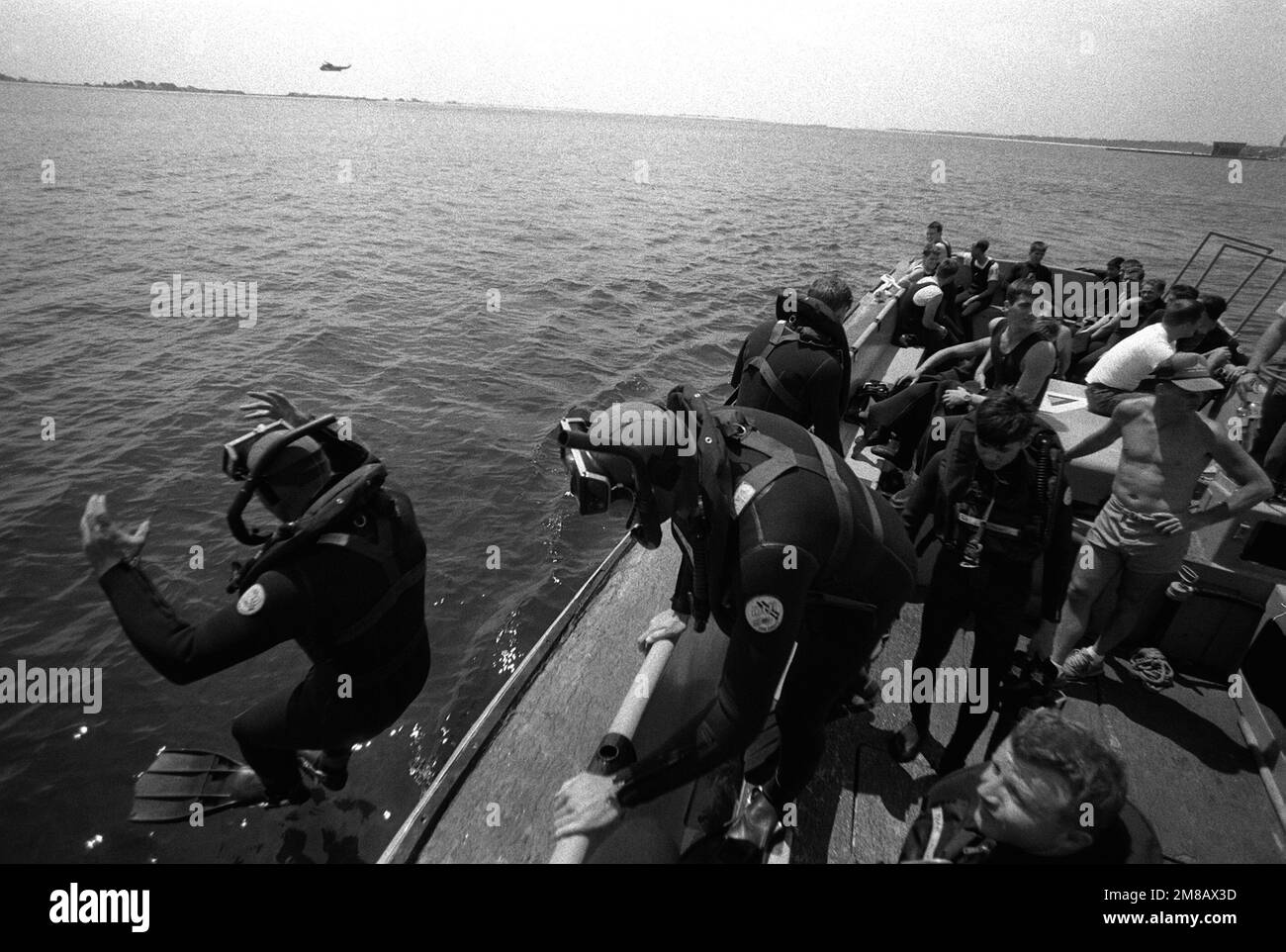 Students wearing scuba diving suits, snorkels, and SAR-1 flotation ...
