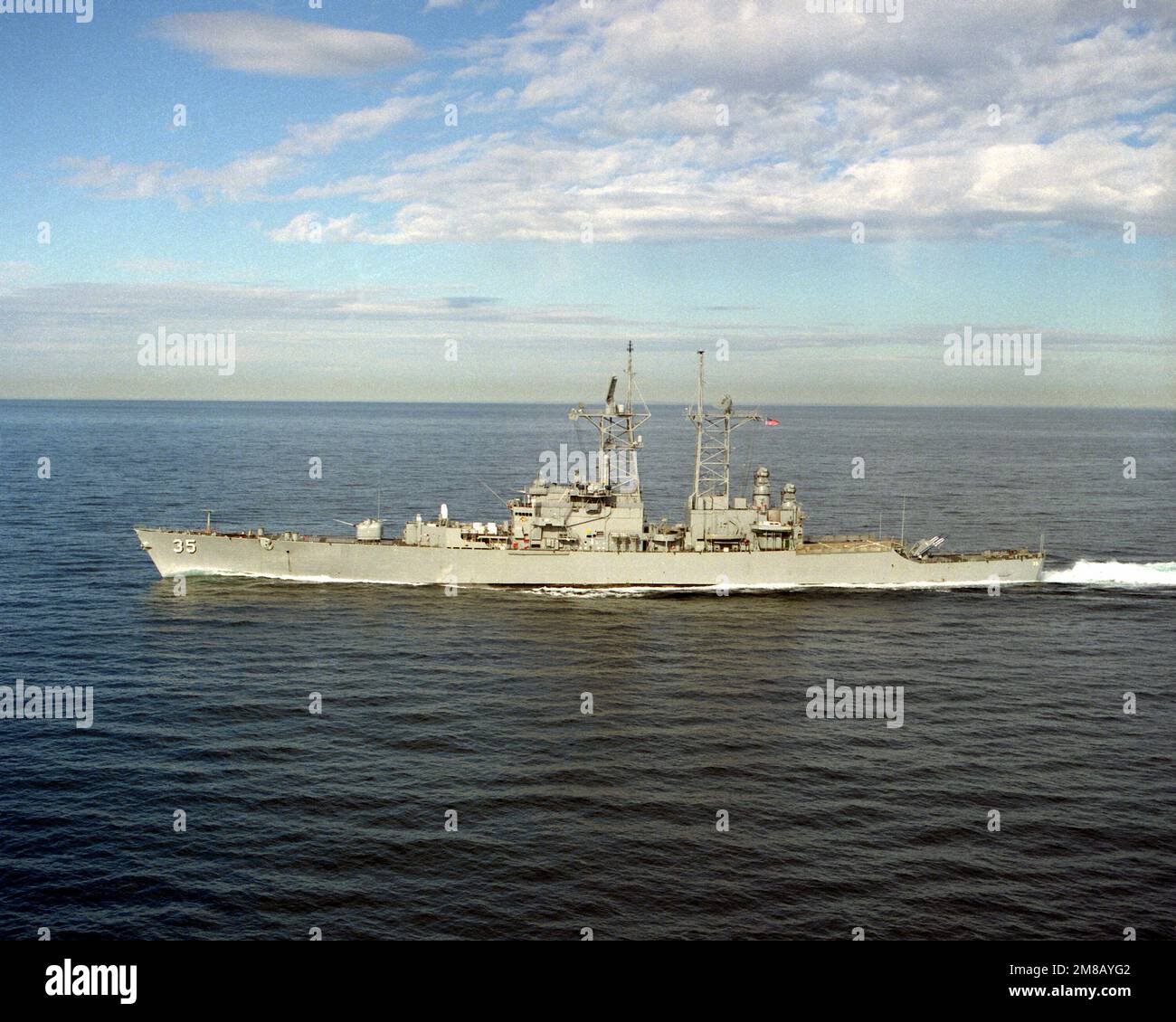 A port beam view of the nuclear-powered guided missile cruiser USS ...