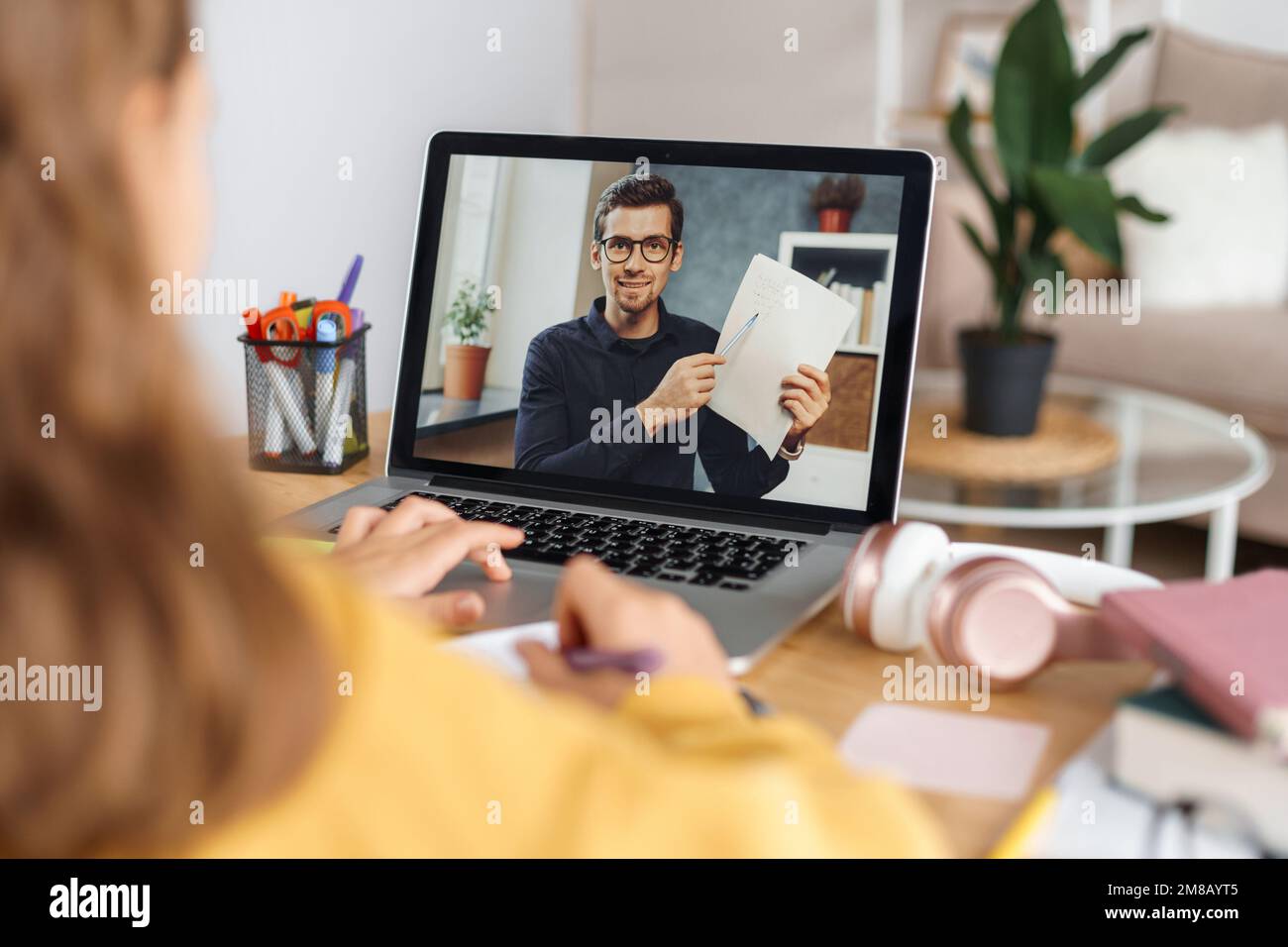 Remote learning. Male teacher having online math class with pupil ...