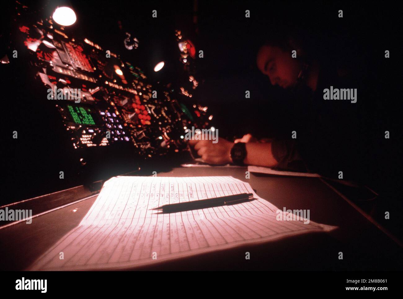 A member of the 8th Special Operations Squadron works at a control ...