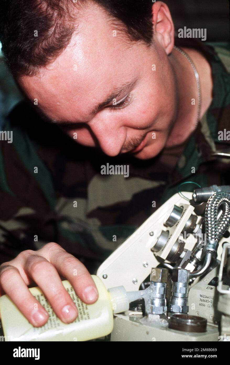 SGT. Ronald L. Panhorst, a photo system sensor specialist, checks for ...