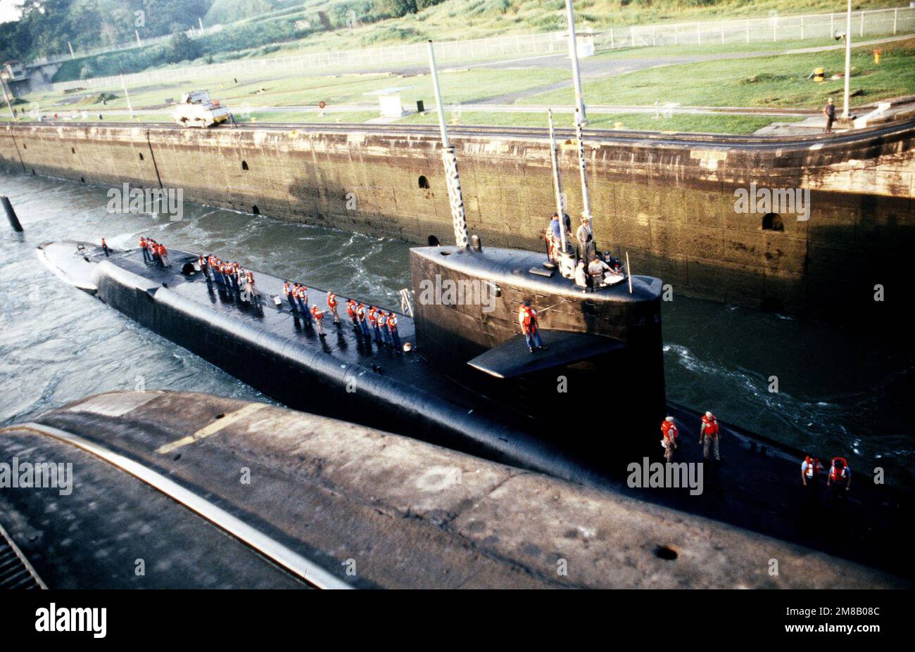 Crewmen stand on the deck of a US Navy Lafayette class nuclear-powered ...