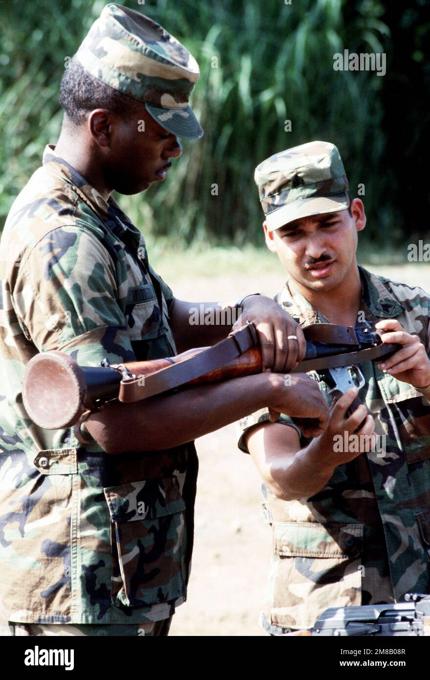 An Army instructor holds a Soviet-made RPG-7 rocket launcher as a ...