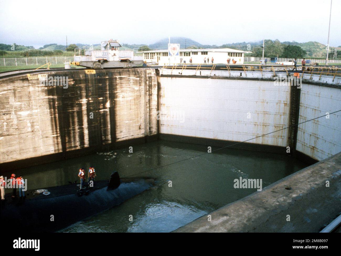 Crewmen stand near the bow of a US Navy Lafayette class nuclear-powered ...