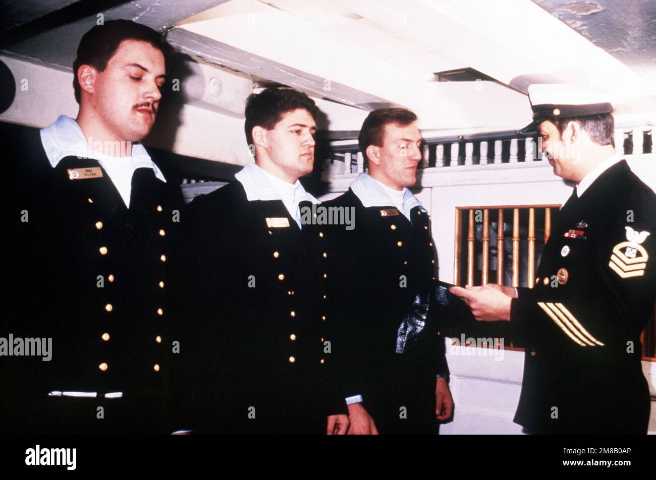 CHIEF Boatswain's Mate Ken Cook inspects the uniforms of Boatswain's ...