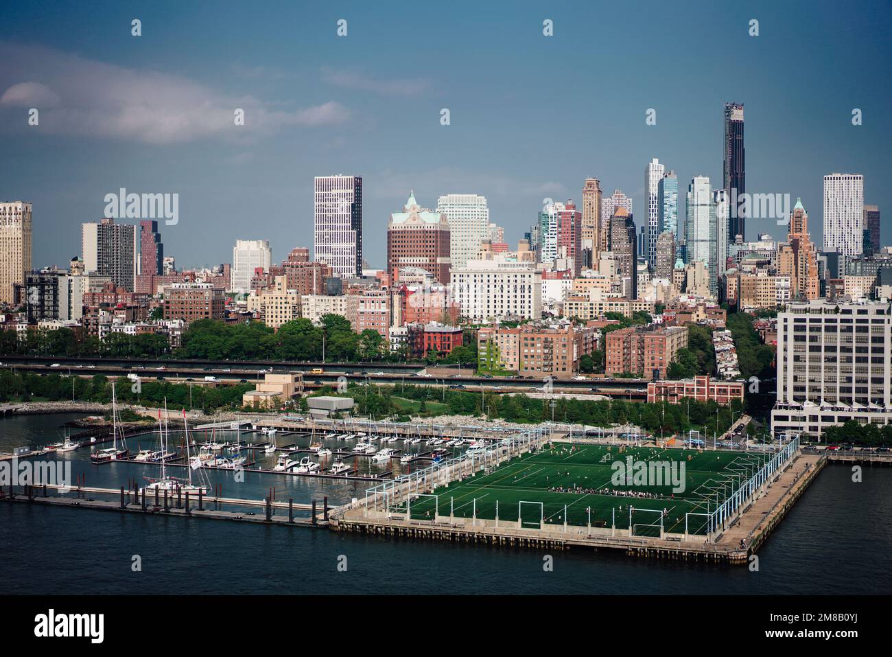 This is an aerial view on Brooklyn and its skyline in the background ...