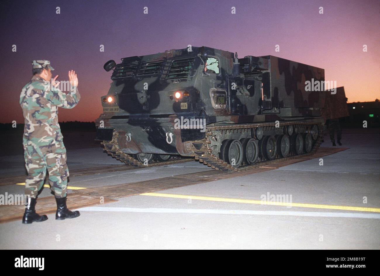 STAFF Sergeant Johnny Maldonado directs an M-270 multiple launch rocket ...