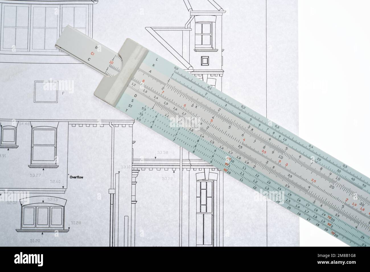 Architects drawings with a slide ruler. An old fashioned way to make ...