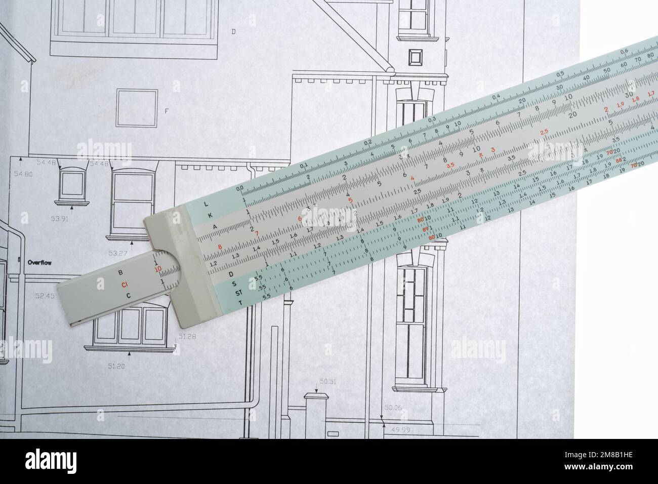 Architects drawings with a slide ruler. An old fashioned way to make ...