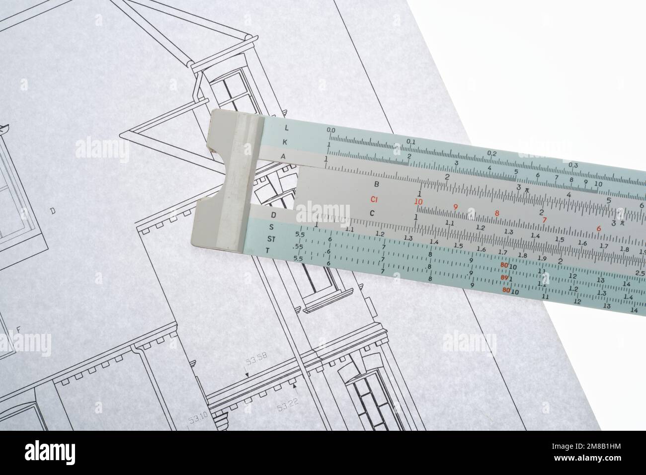 Architects drawings with a slide ruler. An old fashioned way to make ...
