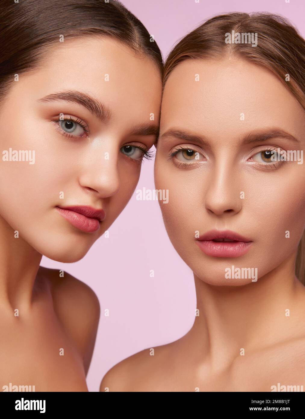 Perfection. Portrait of two young, beautiful girls with well-kept fresh ...