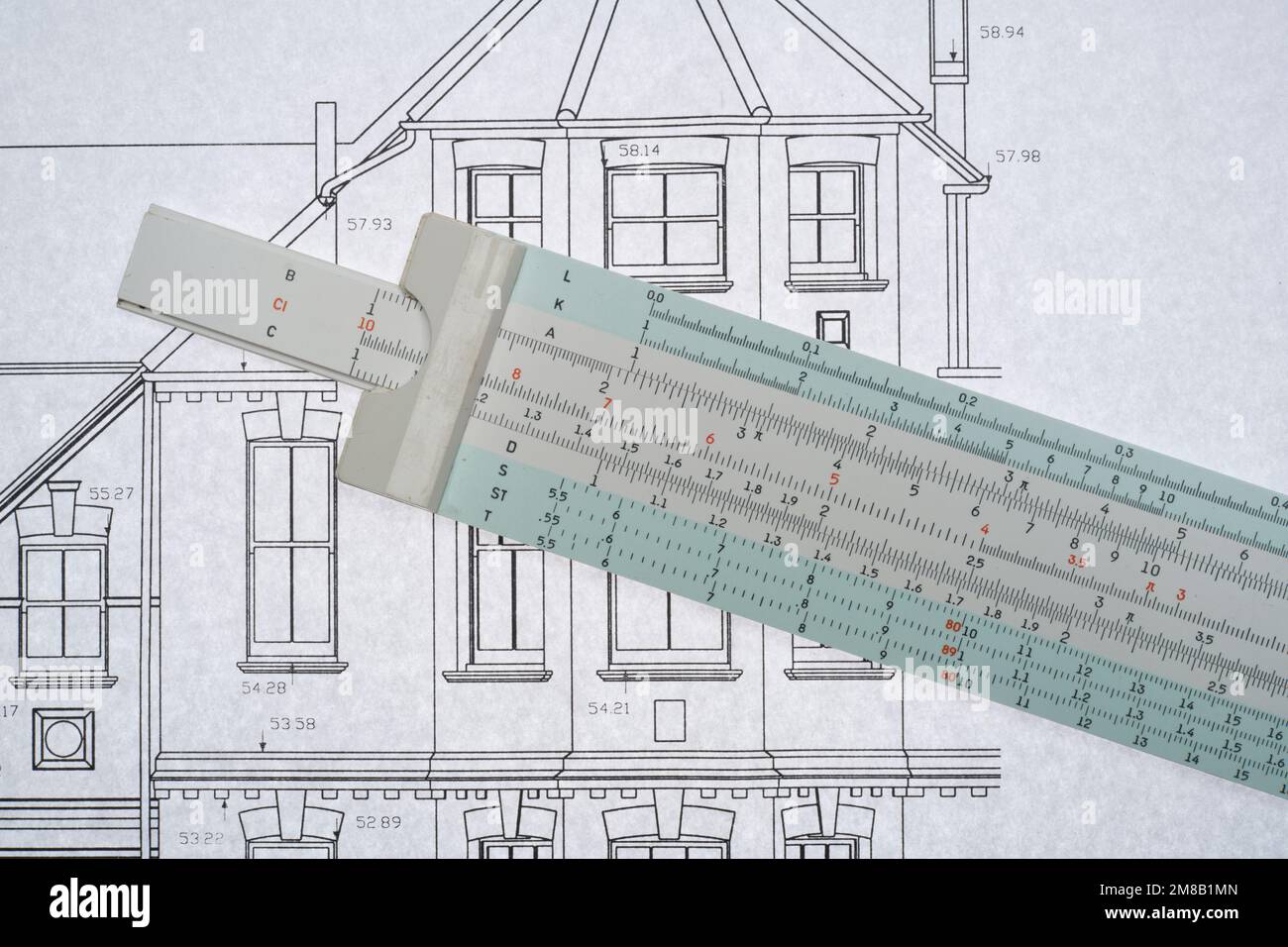 Architects drawings with a slide ruler. An old fashioned way to make ...