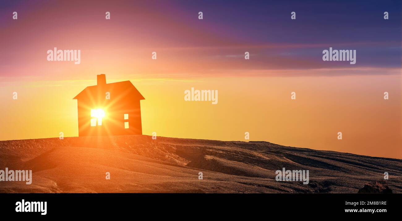 Model of house on sunset evening. Silhouette small house against sunset ...