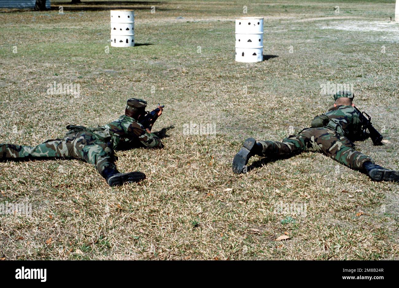 Recruits practice aiming their M16A1 rifles from a prone position ...