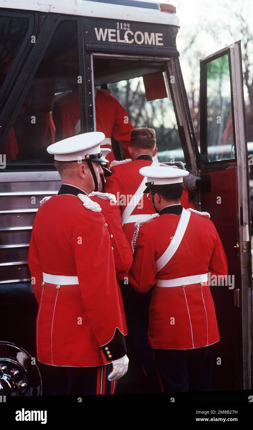 Members of the U.S. Marine Corps Band board a bus after performing in ...