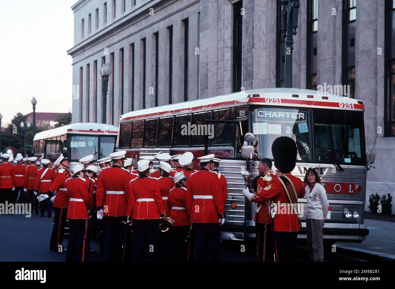 Members of the U.S. Marine Corps Band board a bus after performing in ...