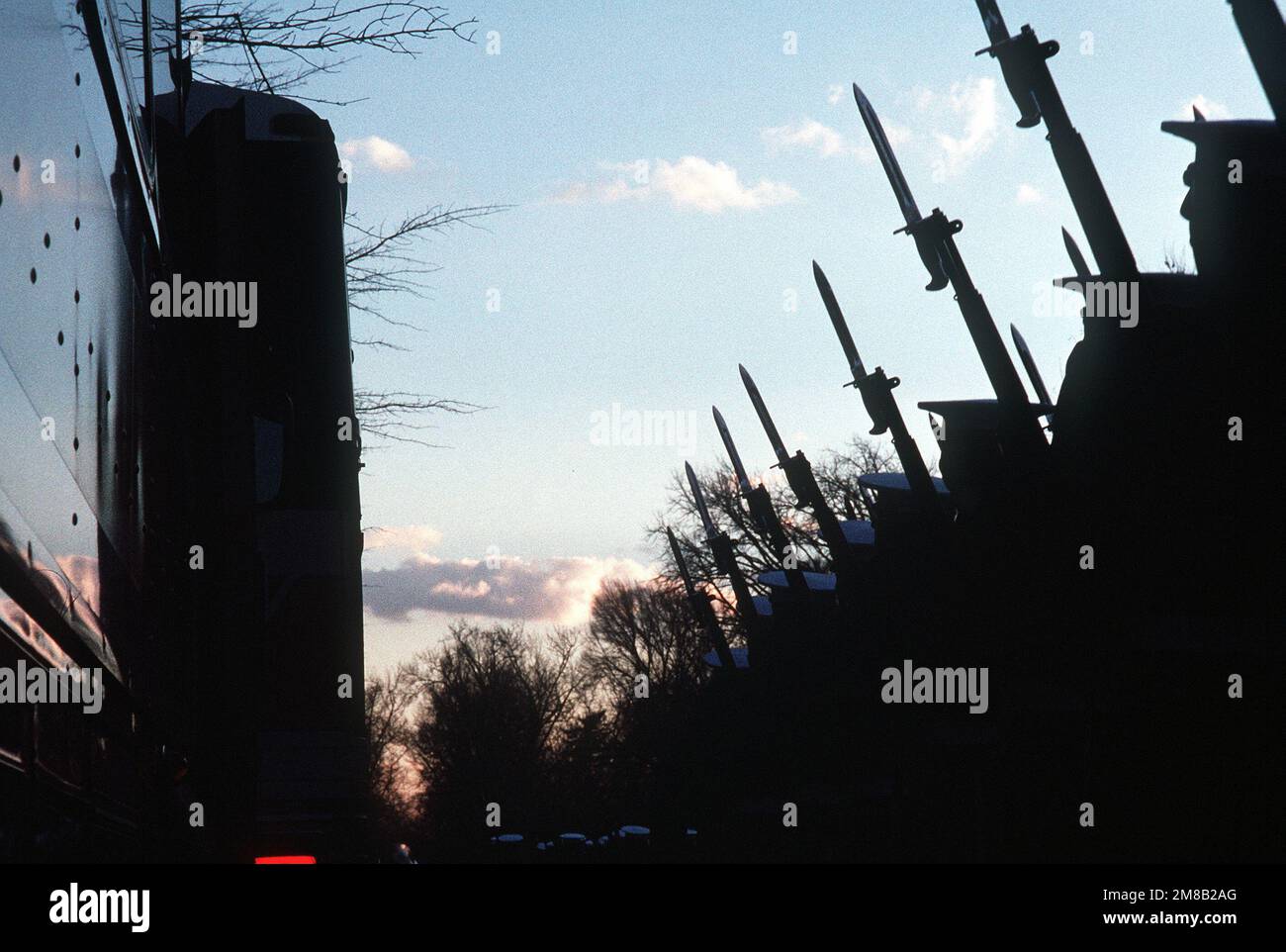U.S. Marine Corps Honor Guard members prepare to board buses after ...