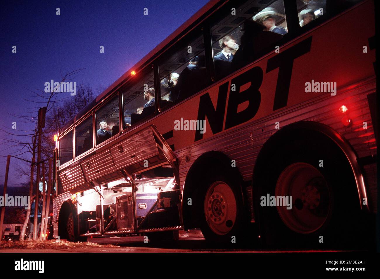 U.S. Coast Guard Band members board buses after participating in the ...