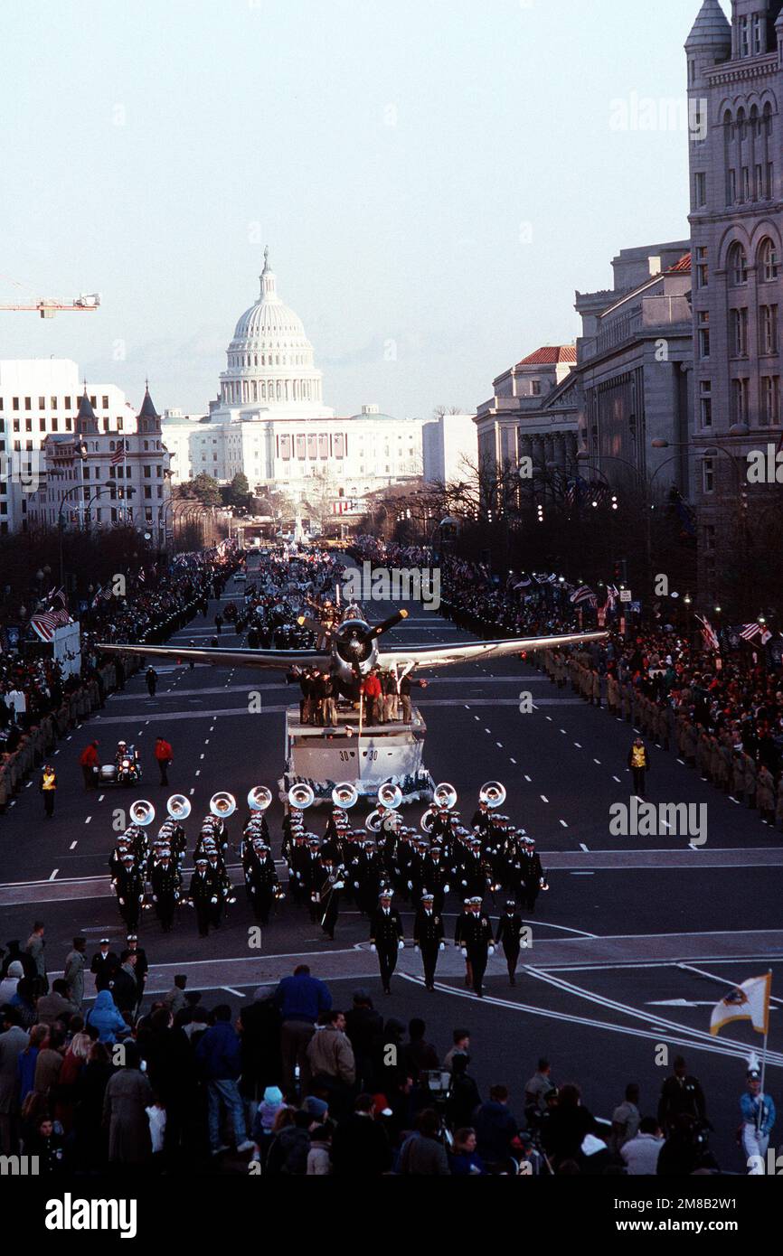The U.S. Navy Band and a TBF Avenger aircraft float participate in the ...