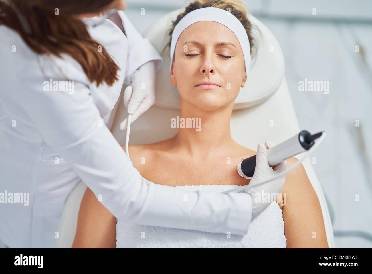 Woman having forehead massage hi-res stock photography and images - Alamy