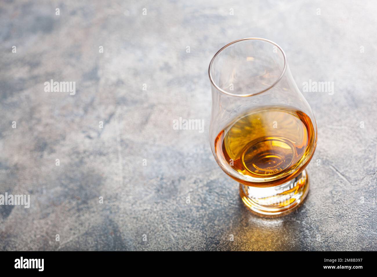 glass of whisky spirit brandy on grey concrete background Stock Photo ...