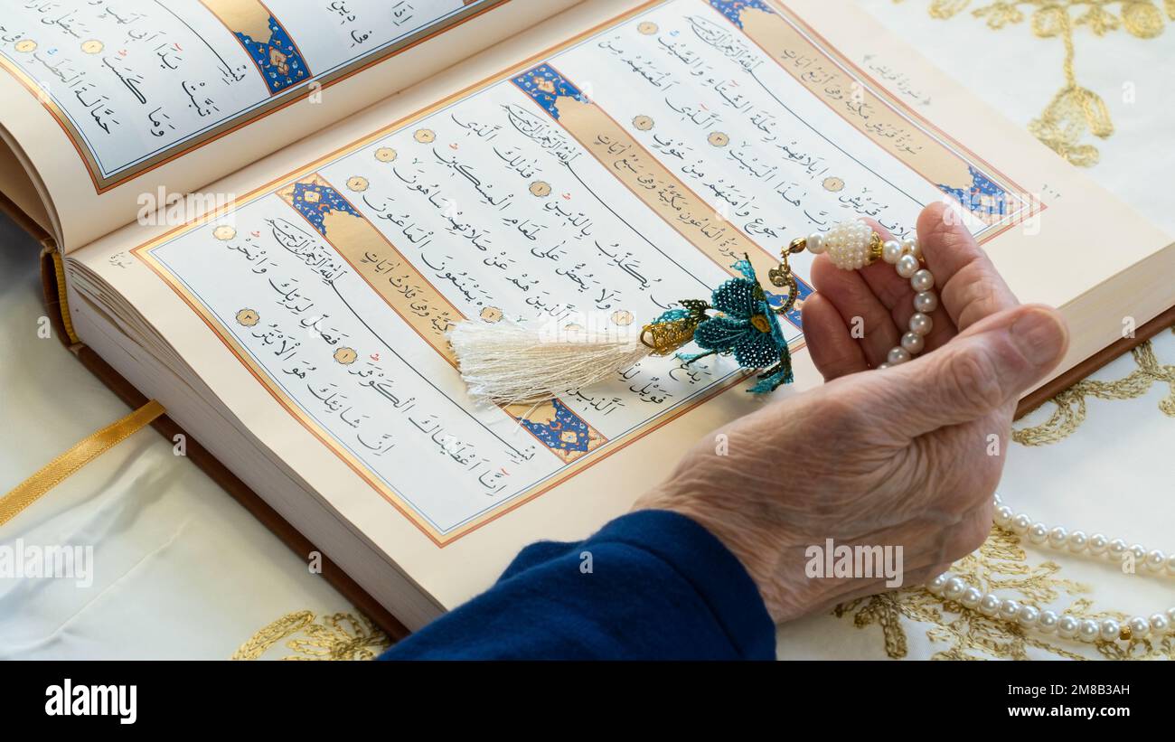Ramadan 2023 is in between March 23 and April 21. Old woman reading The ...
